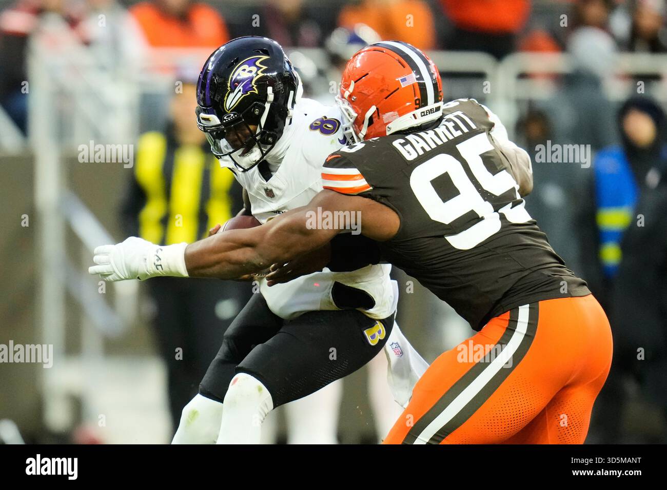 Baltimore Ravens quarterback Lamar Jackson (8) is sacked by Cleveland ...