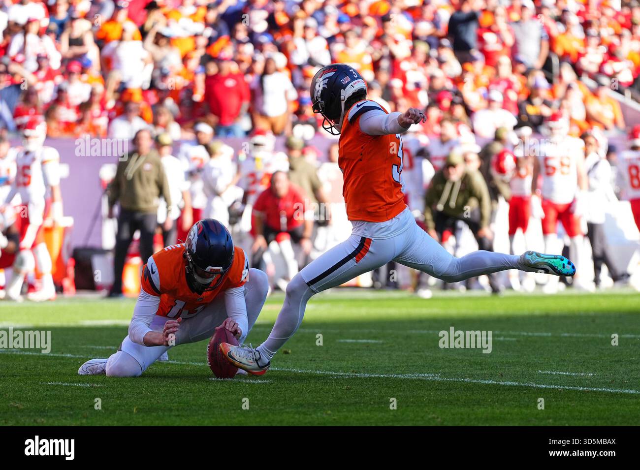 Denver Broncos place kicker Wil Lutz, right, makes a field goal during ...