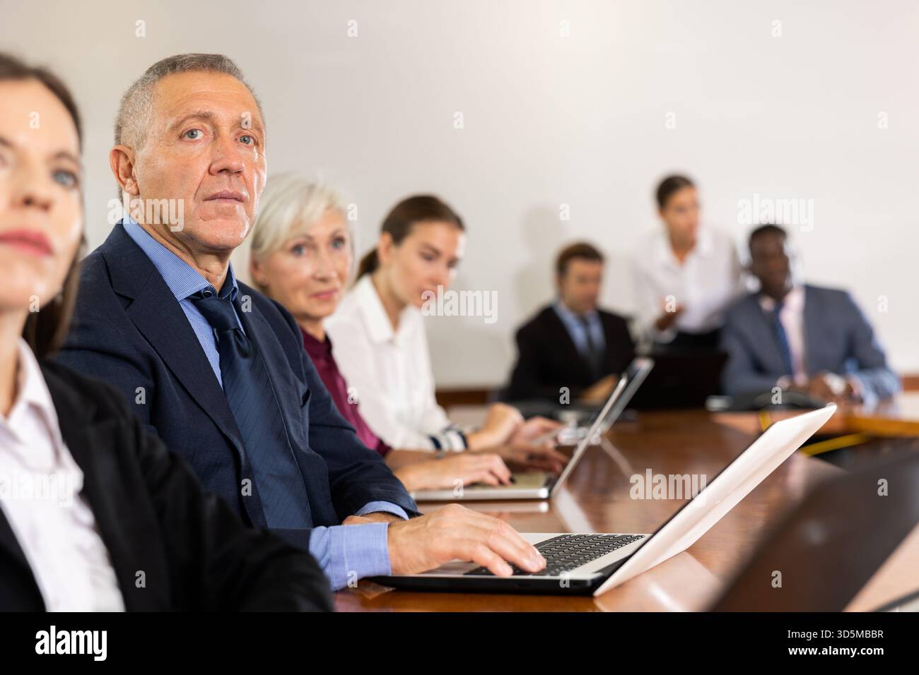 Older middle aged man working in office hi-res stock photography and ...
