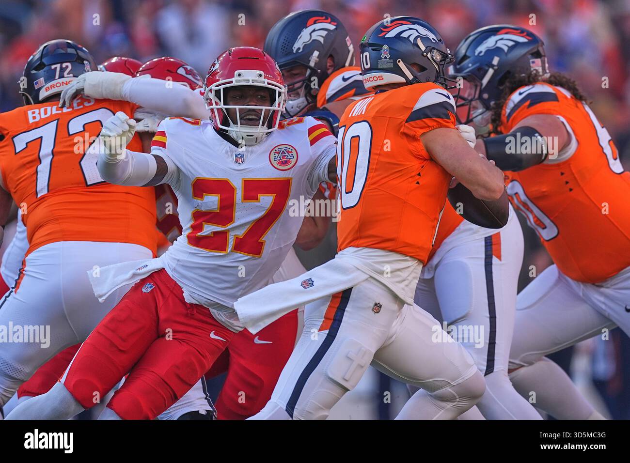Denver Broncos quarterback Bo Nix (10) is sacked by Kansas City Chiefs ...