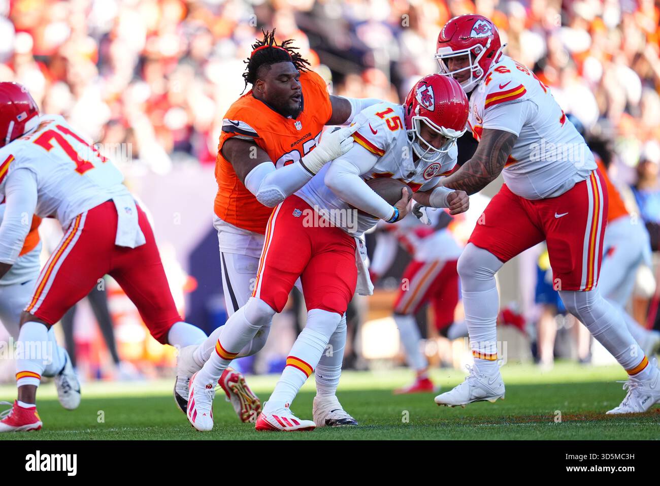 Denver Broncos defensive tackle Malcolm Roach loses his helmet while ...