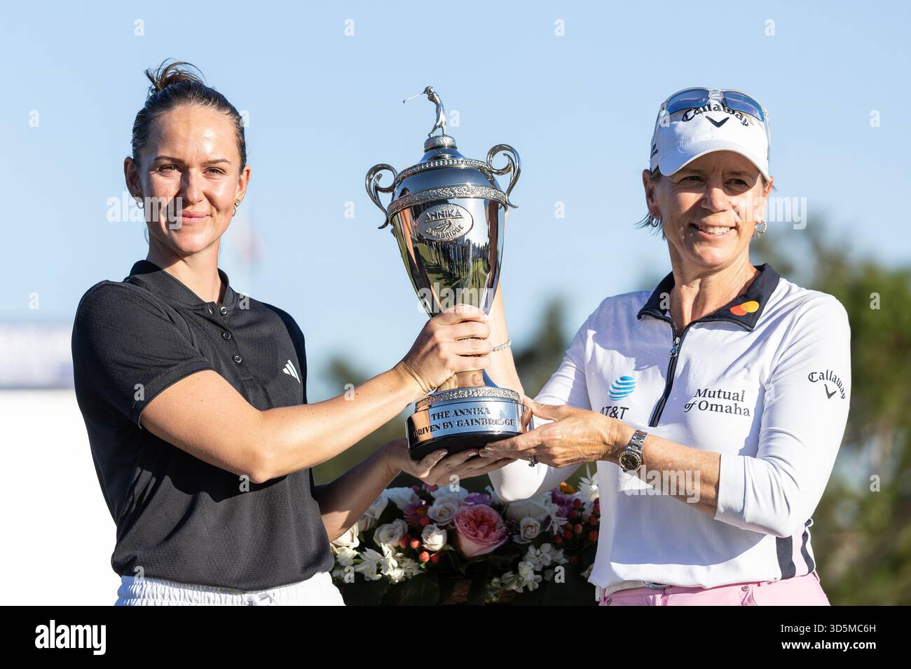 Linn Grant, left, and Annika Sorenstam, right, hold the championship ...