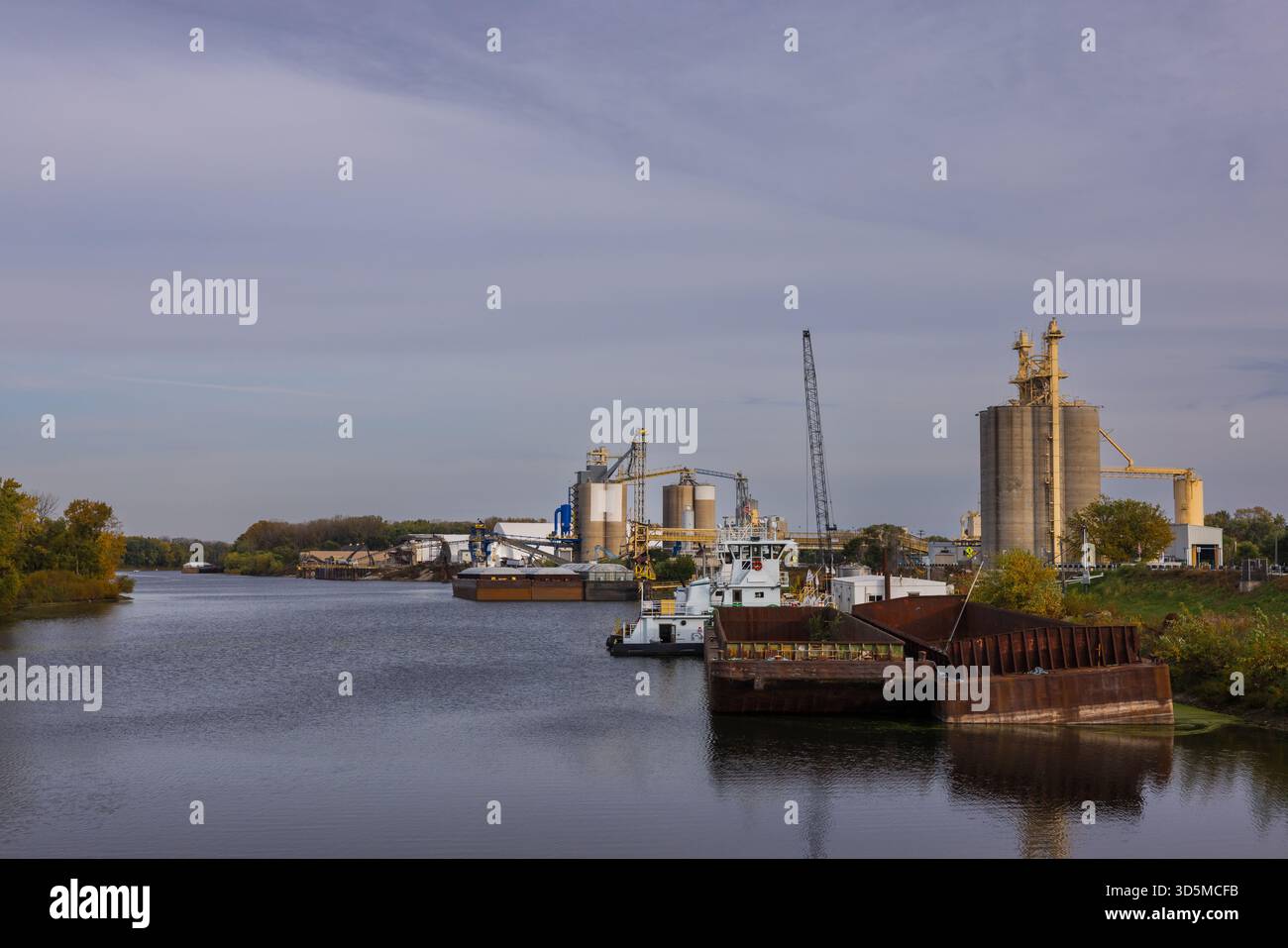 A grain loading facility with barges along the Mississippi River in ...