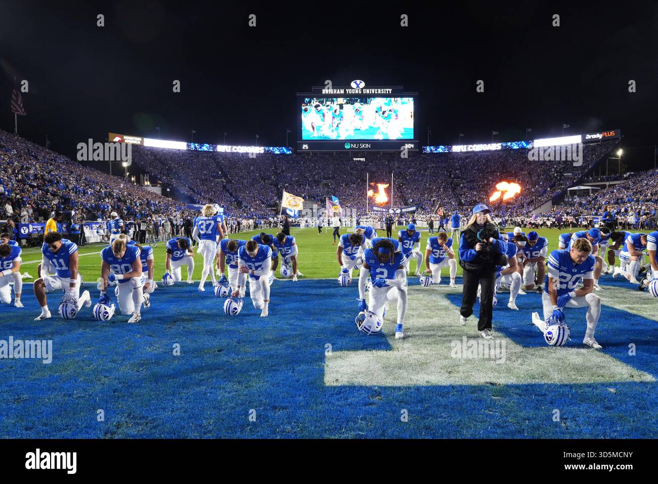 BYU players kneel in the end zone before an NCAA college football game, against TCU, Saturday ...