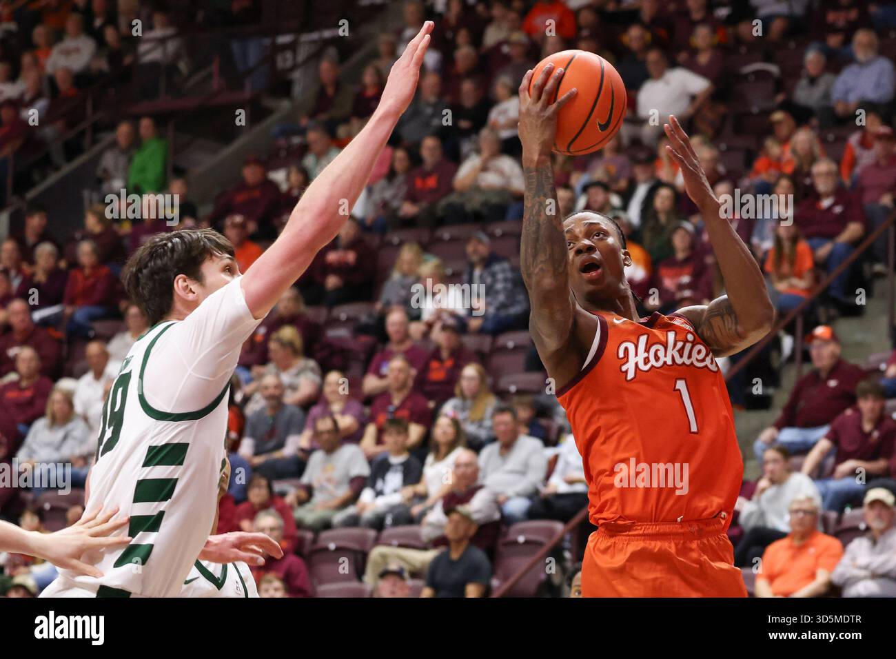 November 16, 2025: Virginia Tech Hokies forward Tobi Lawal (1) lays the ...