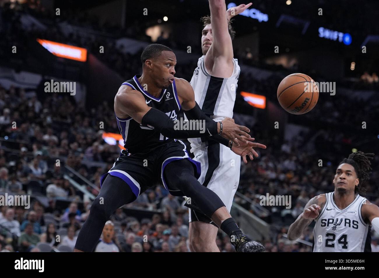 Sacramento Kings guard Russell Westbrook, left, passes around San ...