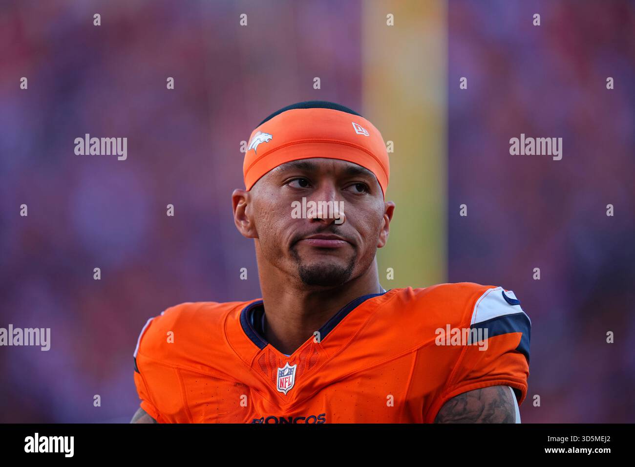 Denver Broncos tight end Evan Engram (1) watches from the sidelines ...