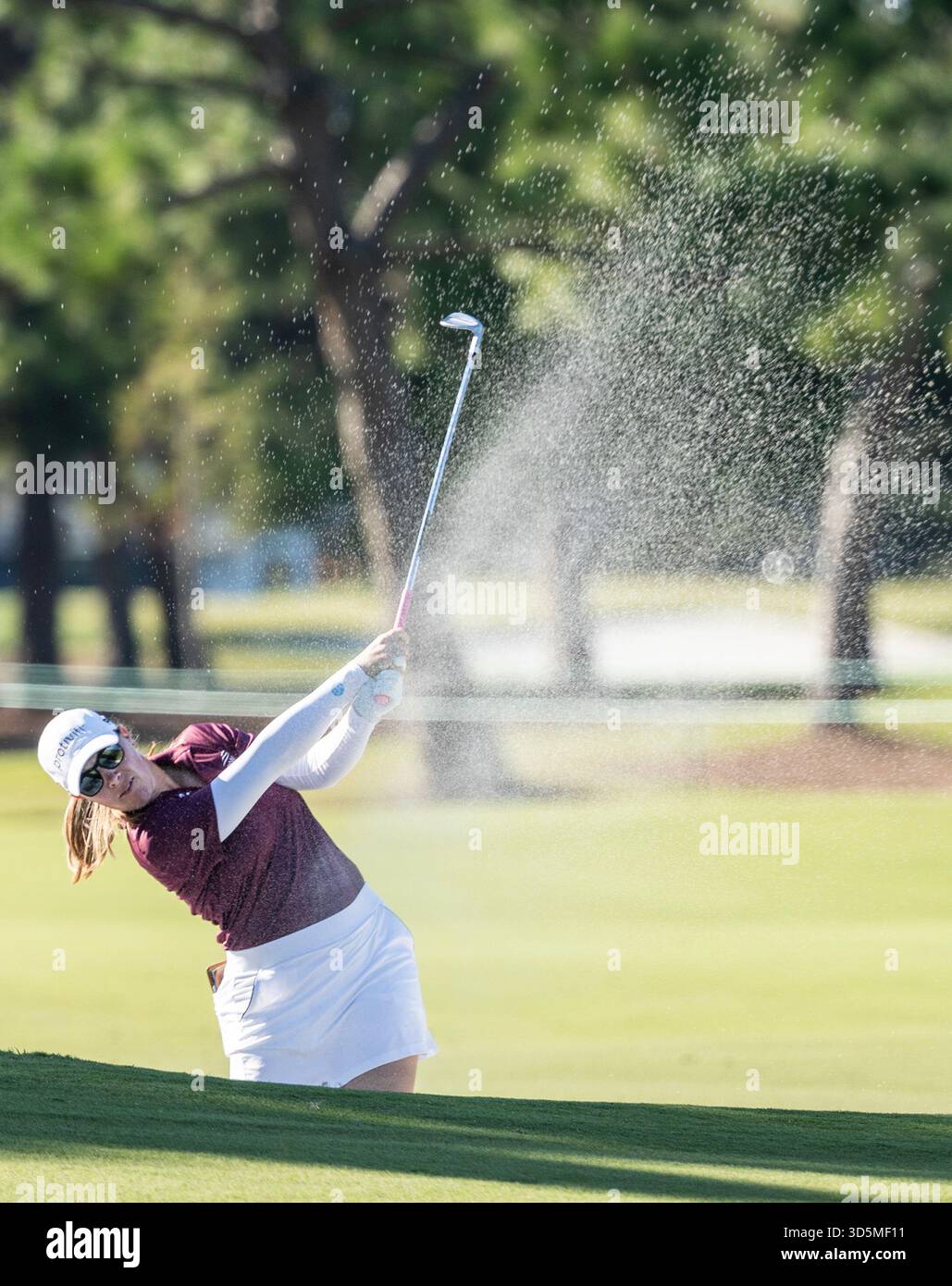 Jennifer Kupcho chips the ball out of the sand on the 16th fairway ...