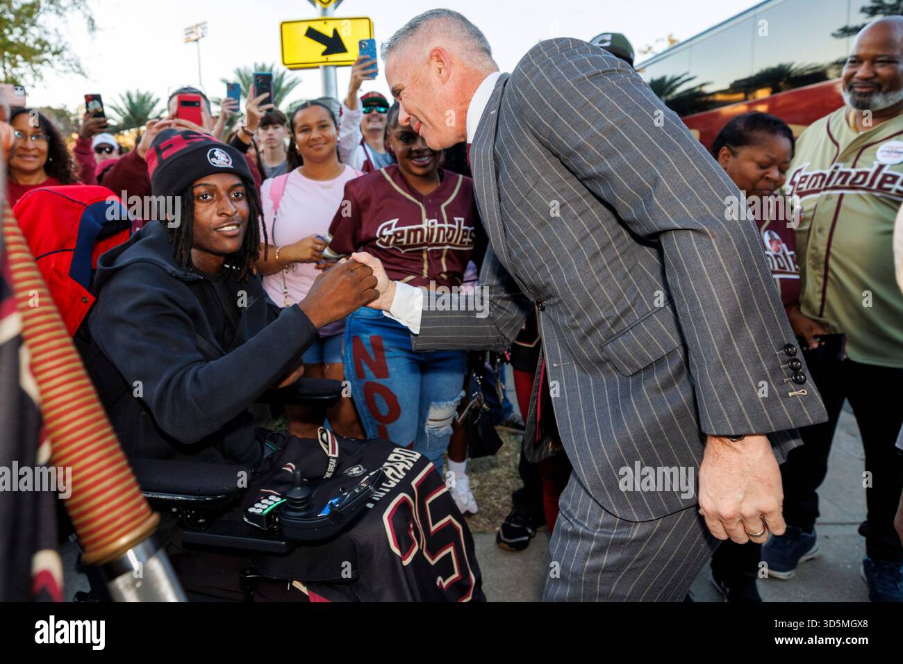 Florida State linebacker Ethan Pritchard (35) greets head coach Mike ...