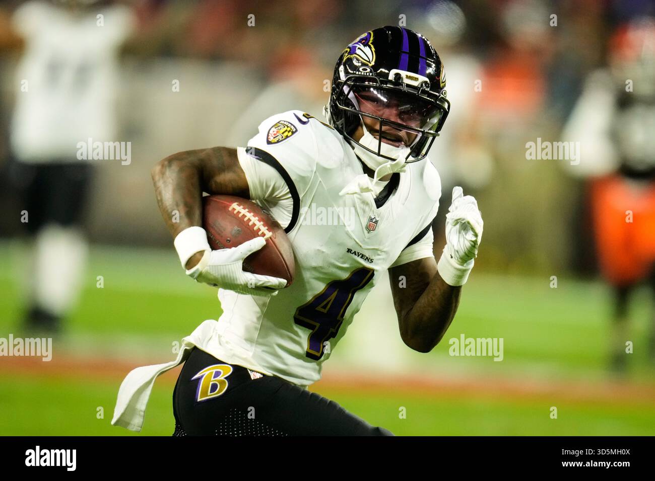 Baltimore Ravens wide receiver Zay Flowers (4) gains yards after a ...