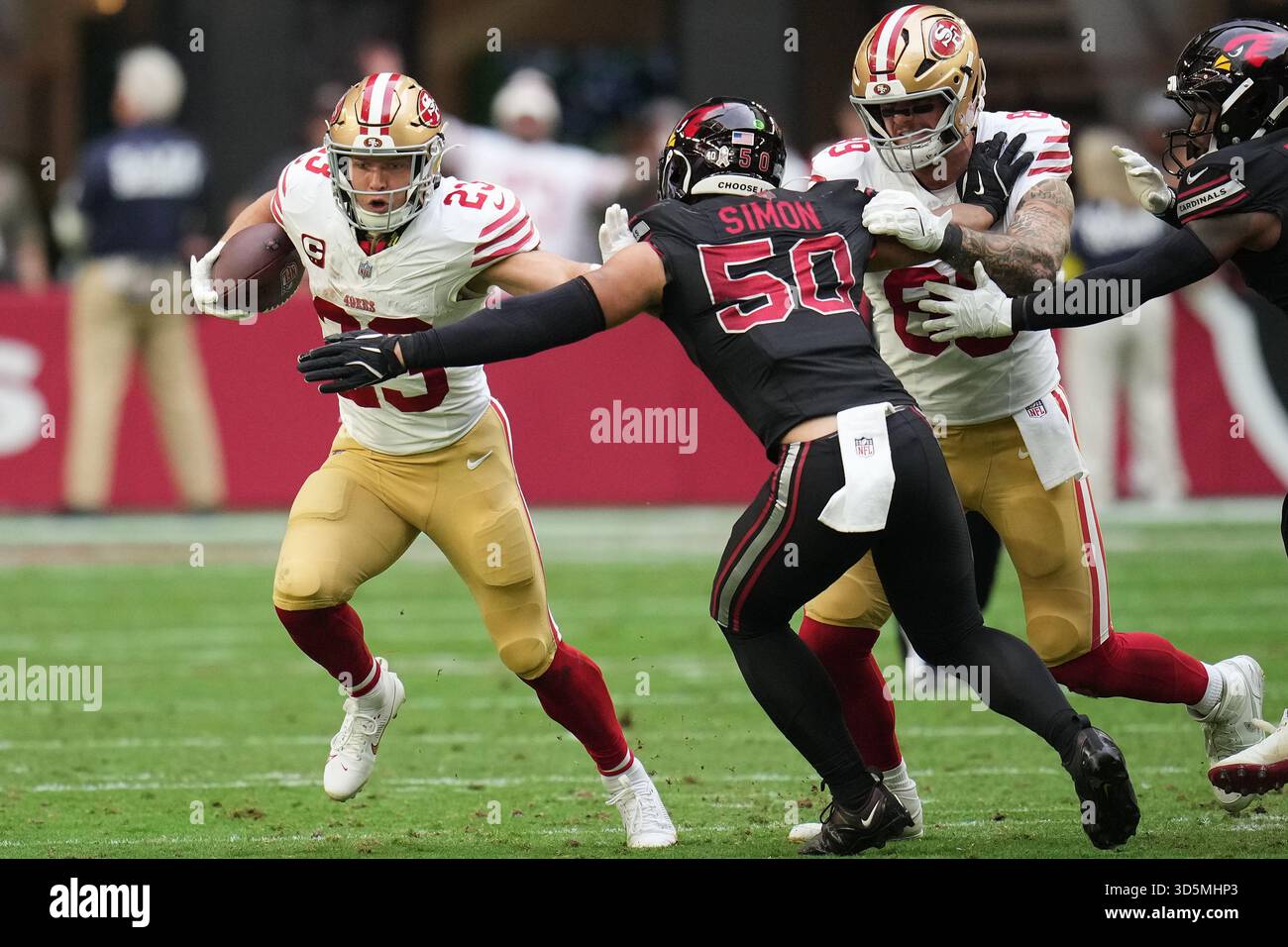 San Francisco 49ers running back Christian McCaffrey (23) runs as tight ...