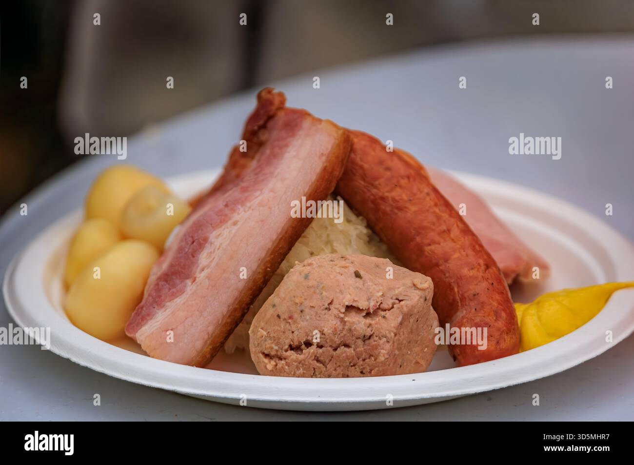 Traditional Alsacian choucroute garnie, sauerkraut with sausages, bacon ...
