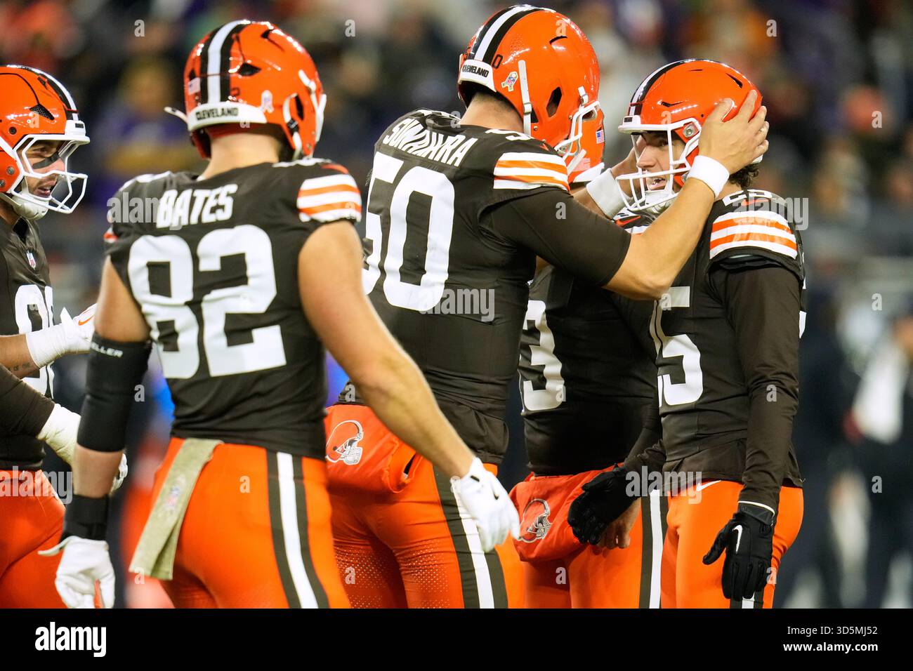 Cleveland Browns' Brenden Bates (82), Rex Sunahara (50) and others ...