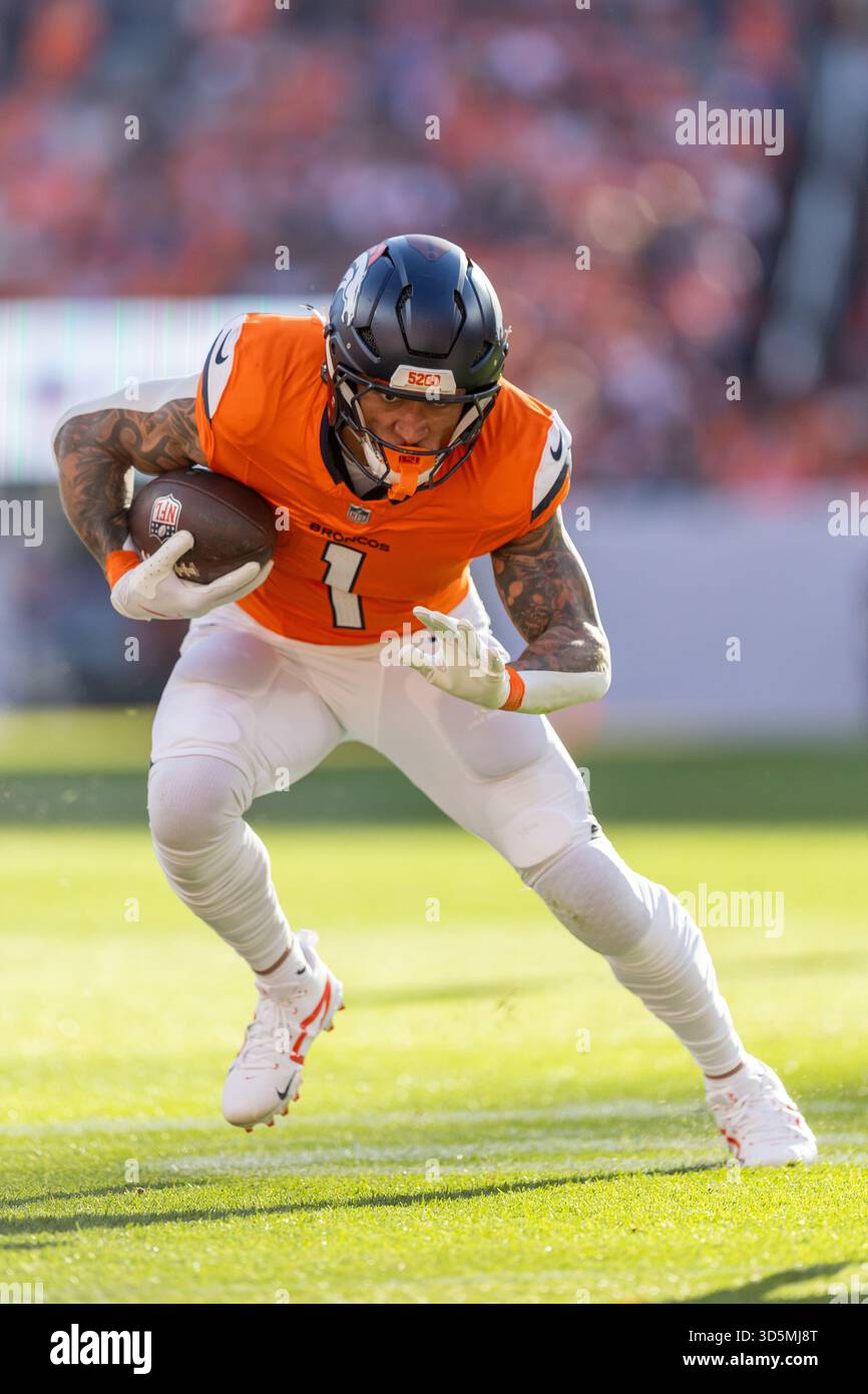 Denver Broncos tight end Evan Engram (1) catches a pass and runs ...