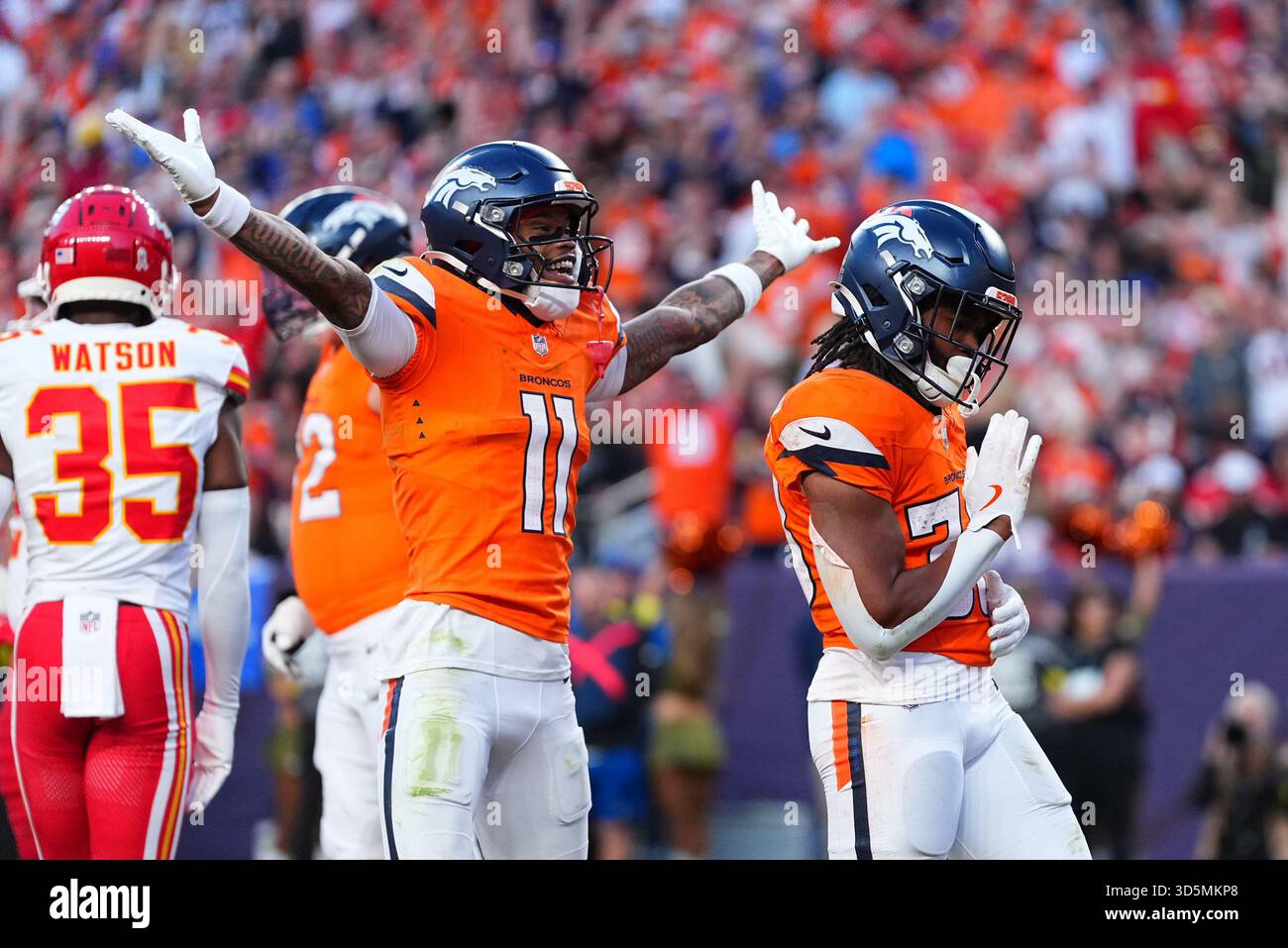 Denver Broncos running back Jaleel McLaughlin celebrates alongside ...