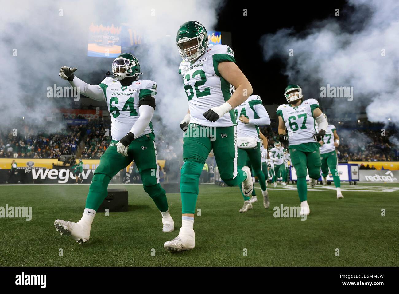Saskatchewan Roughriders' Trevon Tate (64) and teammate Payton Collins ...