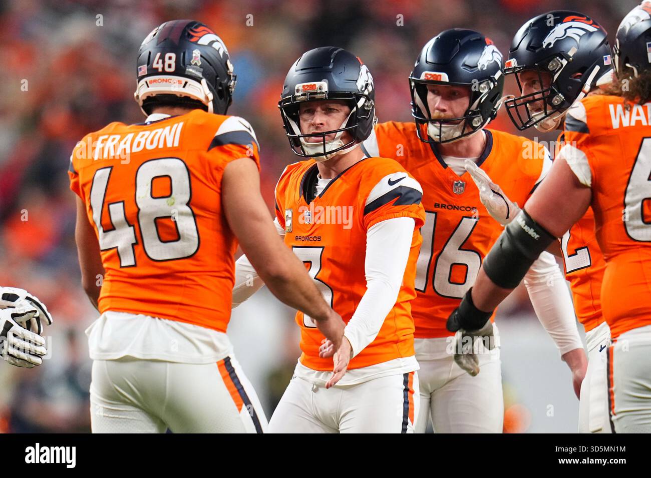 Denver Broncos place kicker Wil Lutz (3) is congratulated by teammates ...