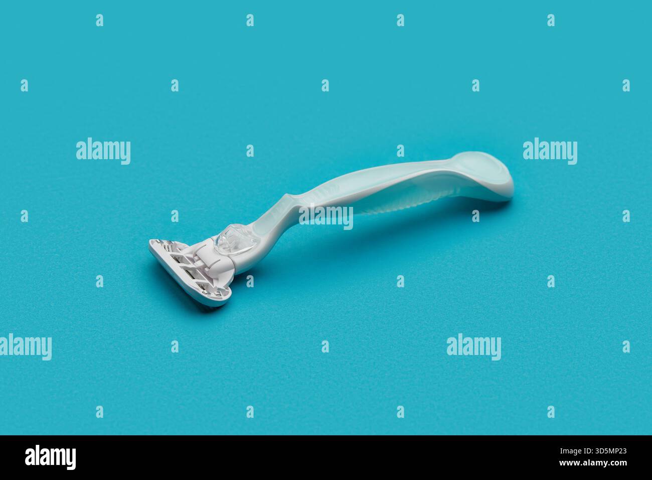 Razor blade on serene blue. Uncomplicated style for a modern touch to ...