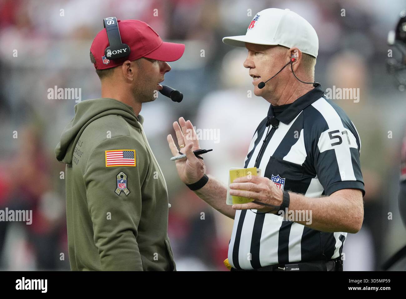 Arizona Cardinals head coach Jonathan Gannon, left, reacts toward referee Carl Cheffers during ...