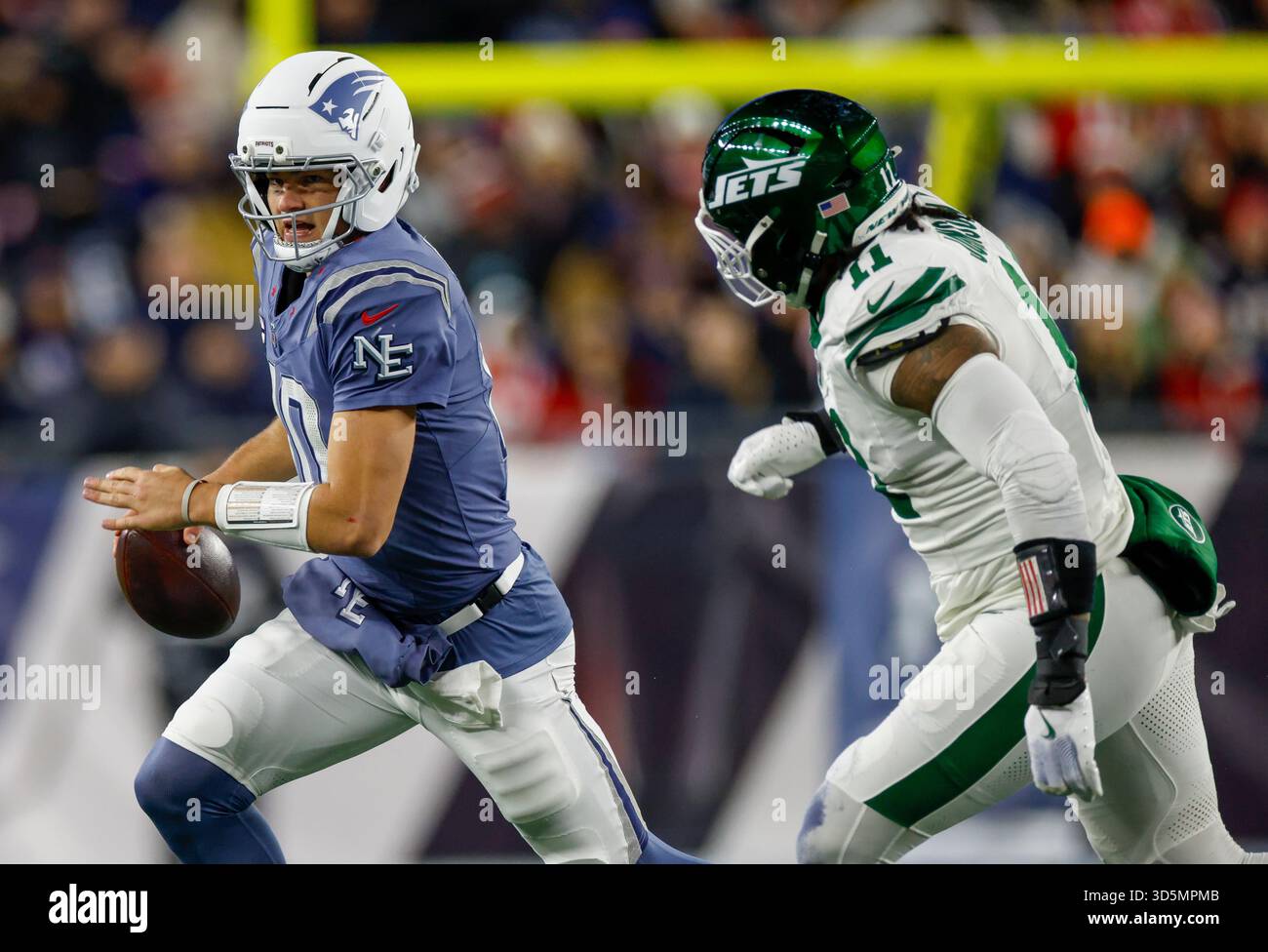 New England Patriots quarterback Drake Maye (10) scrambles out of the ...