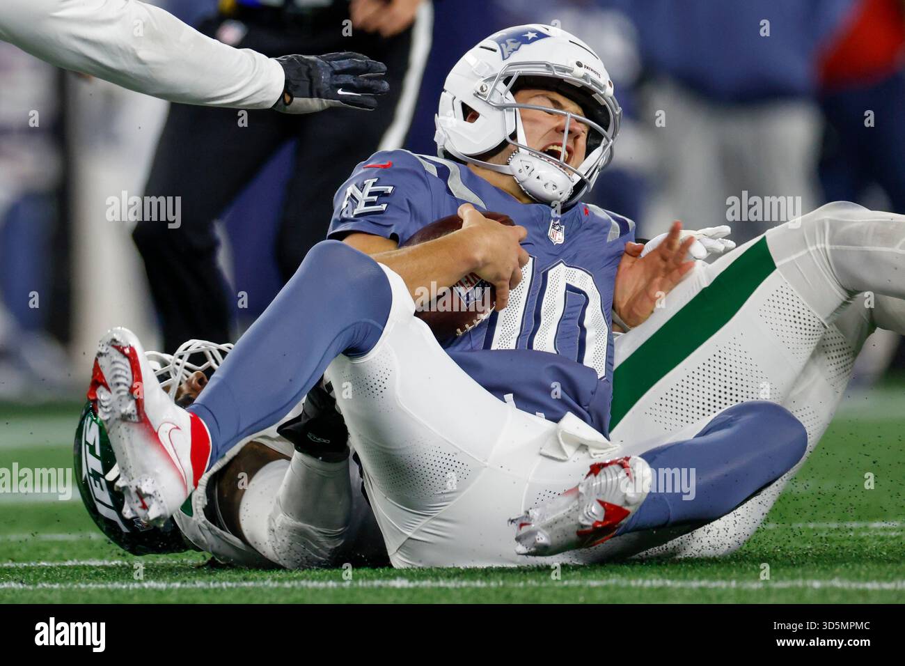 New England Patriots quarterback Drake Maye (10) is sacked by New York ...