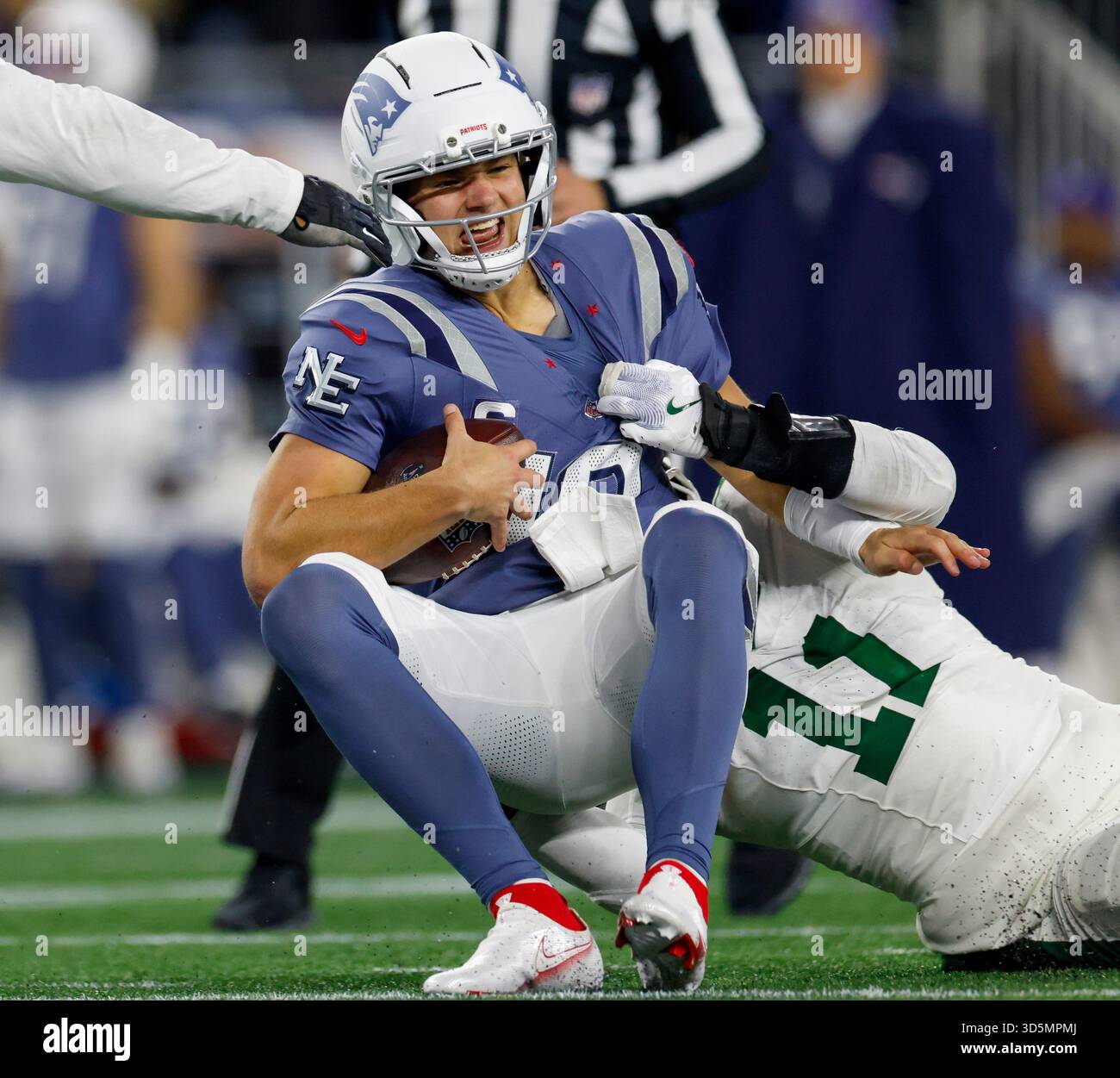New England Patriots quarterback Drake Maye (10) is sacked by New York ...