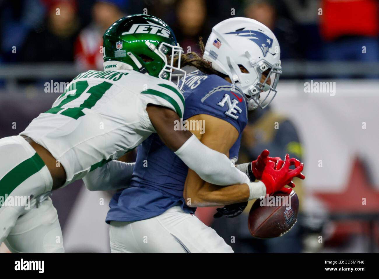 New York Jets cornerback Brandon Stephens (21) prevents New England ...