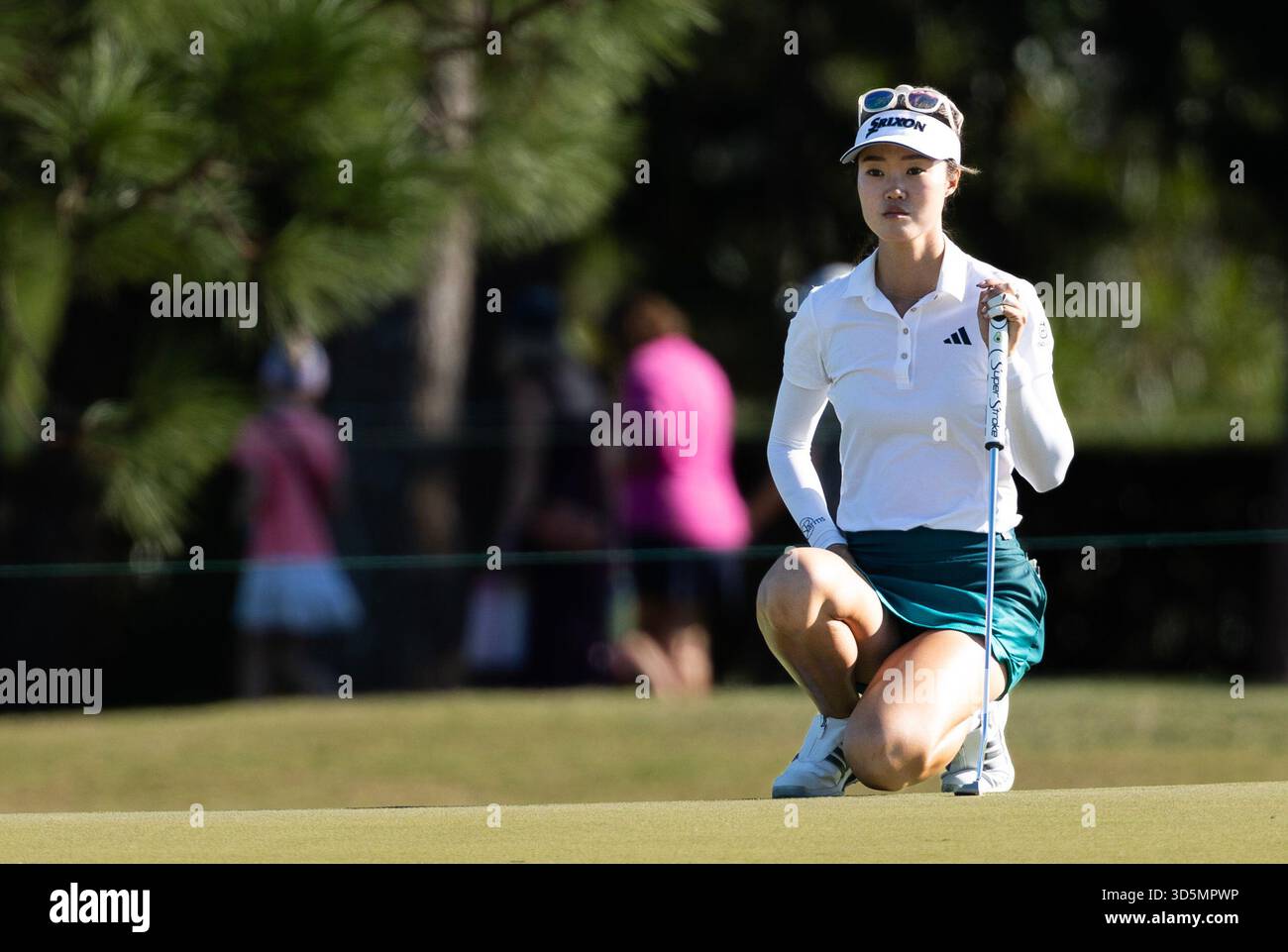 Grace Kim takes a knee on the 15th hole green during the final round of ...