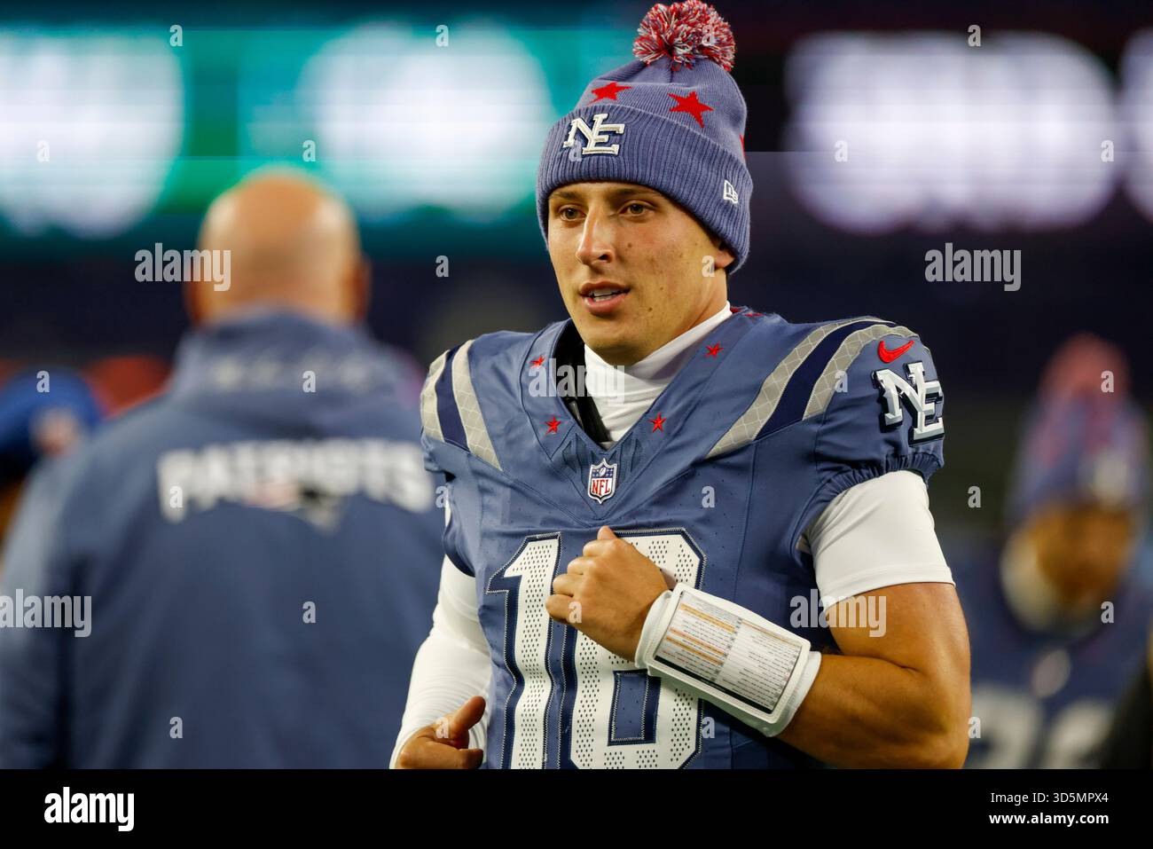 New England Patriots quarterback Tommy DeVito (16) reacts after ...