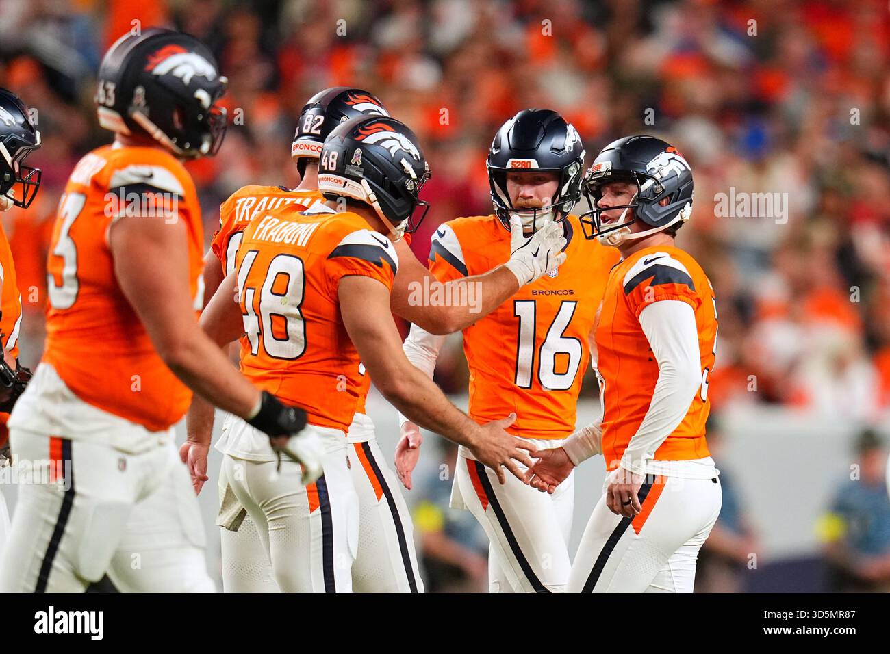 Denver Broncos place kicker Wil Lutz, right, is congratulated by ...