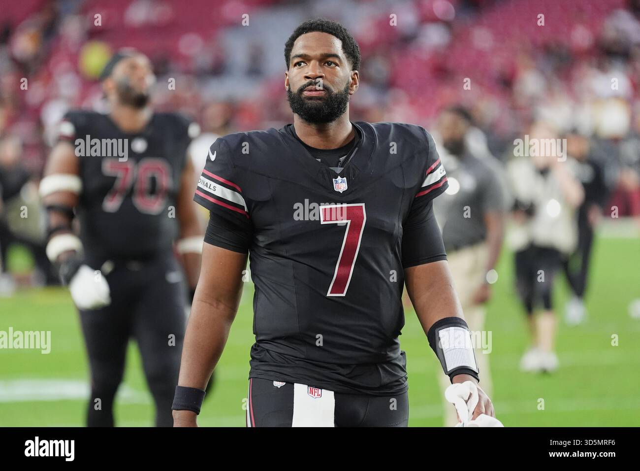 Arizona Cardinals quarterback Jacoby Brissett (7) walks off the field ...