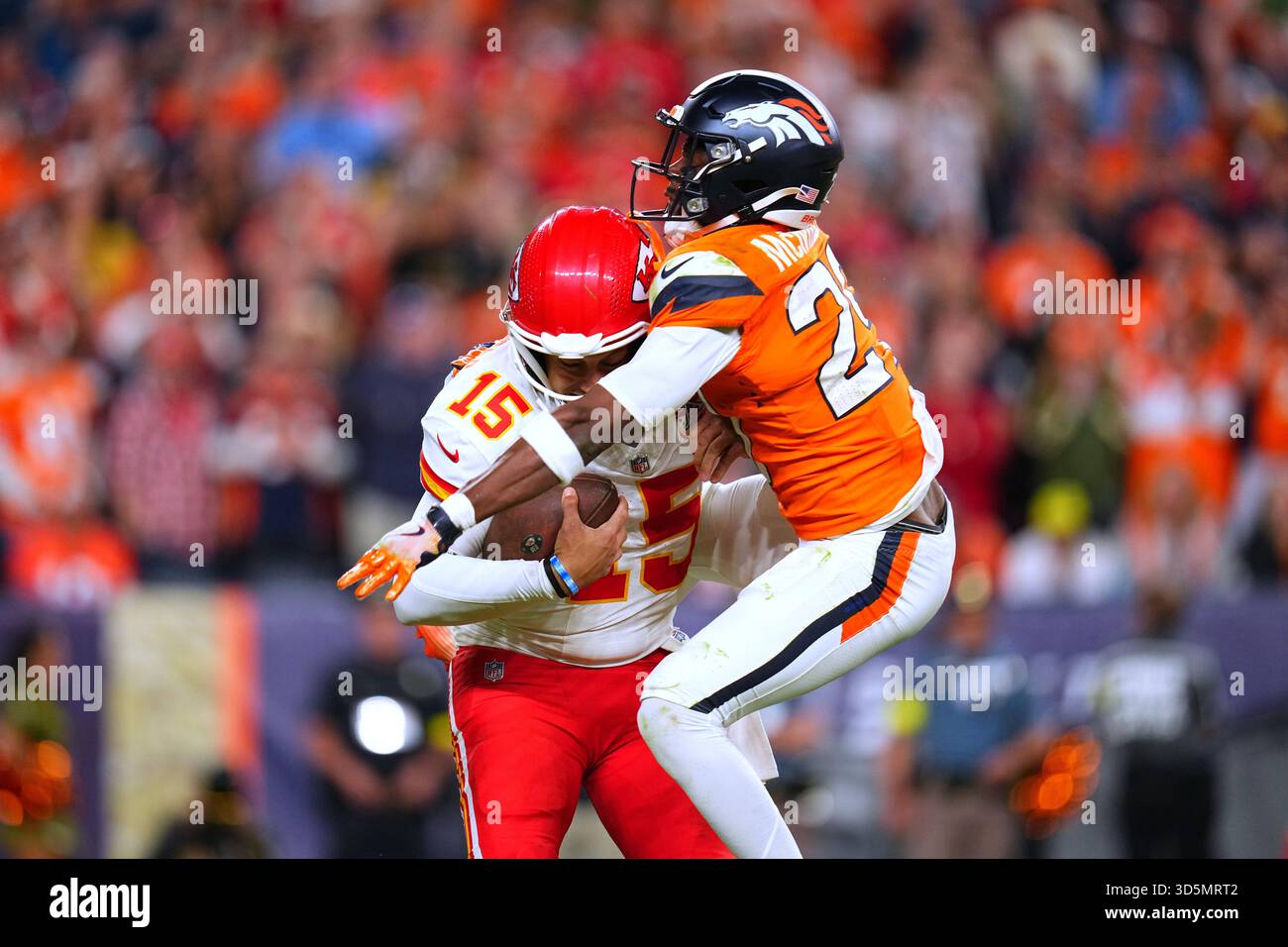 Denver Broncos cornerback Ja'Quan McMillian, right, sacks Kansas City ...
