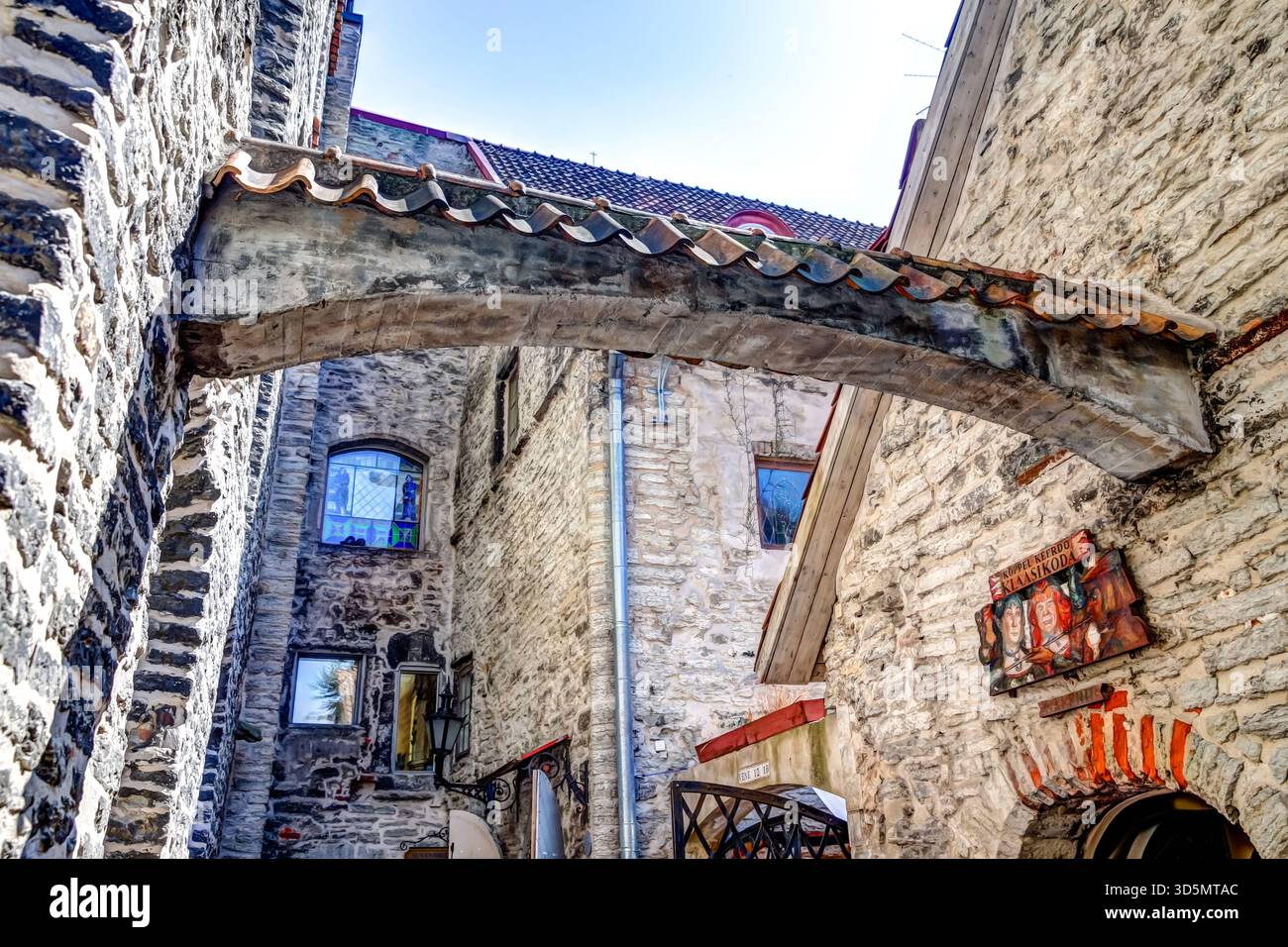 Medieval stone walls and archway in St. Catherine’s Passage, one of ...