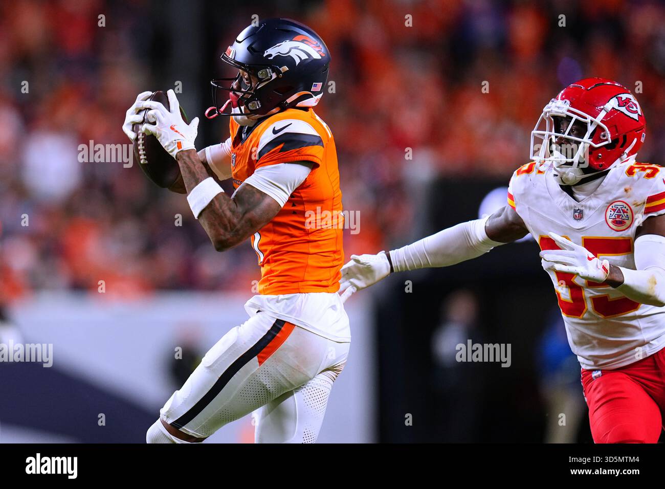 Denver Broncos wide receiver Troy Franklin (11) catches a pass for a 32 ...