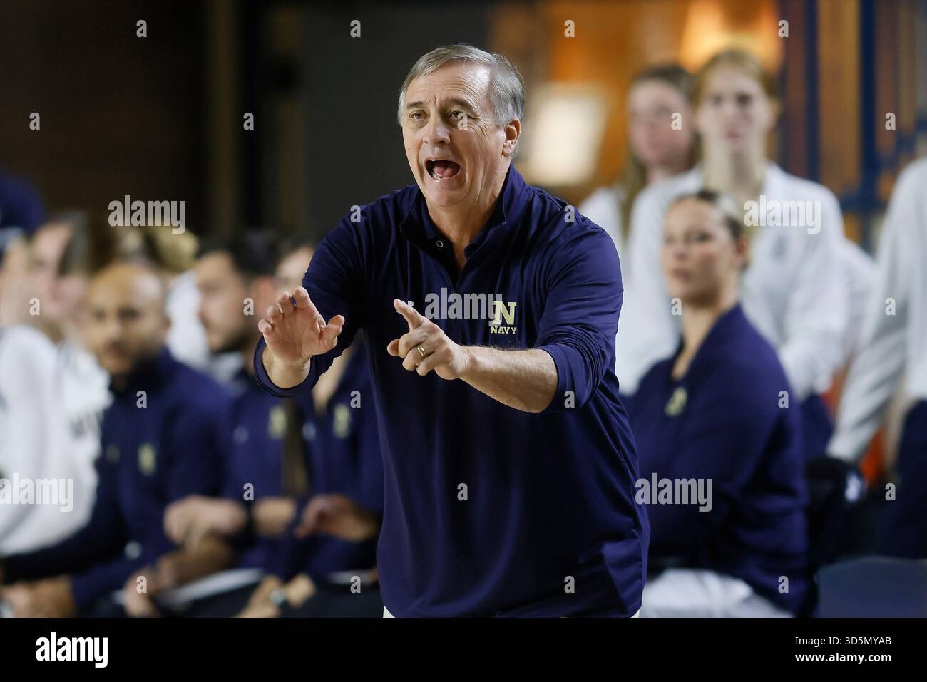 Navy head coach Tim Taylor reacts during the first half of an NCAA ...