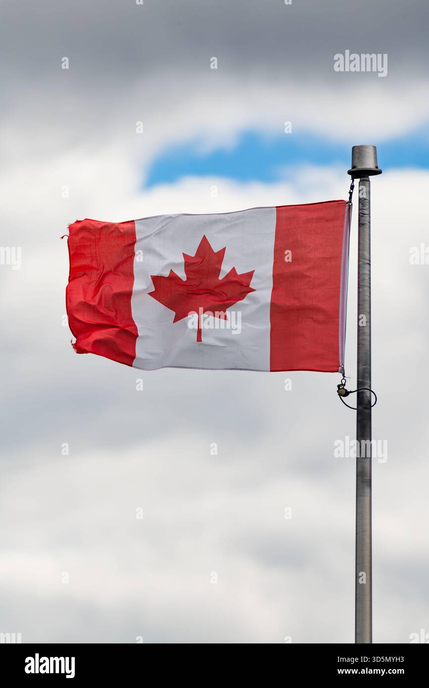 Wind blowing flag through clouds hi-res stock photography and images ...