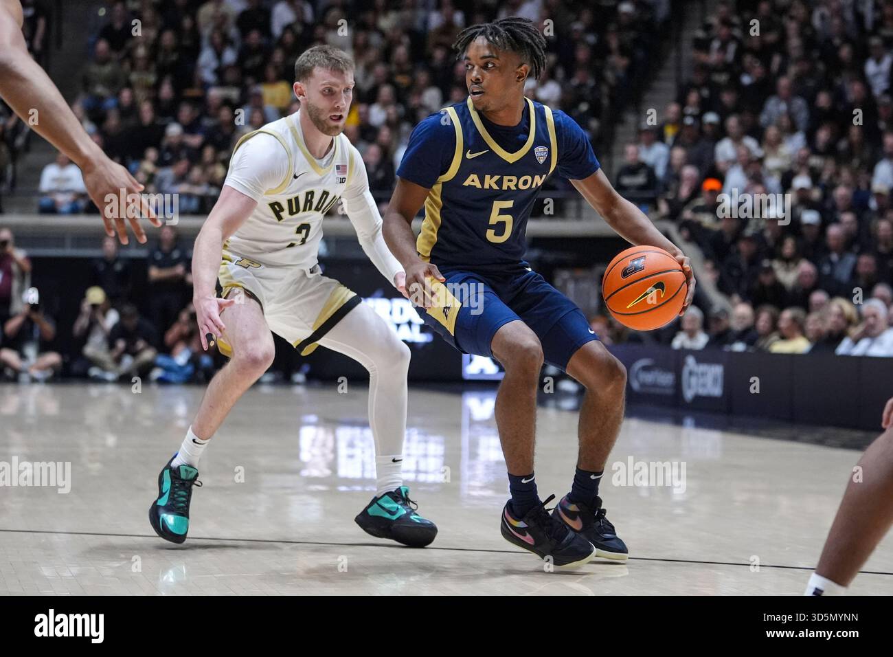 Akron guard Tavari Johnson (5) drives on Purdue guard Braden Smith (3) during the first half of ...
