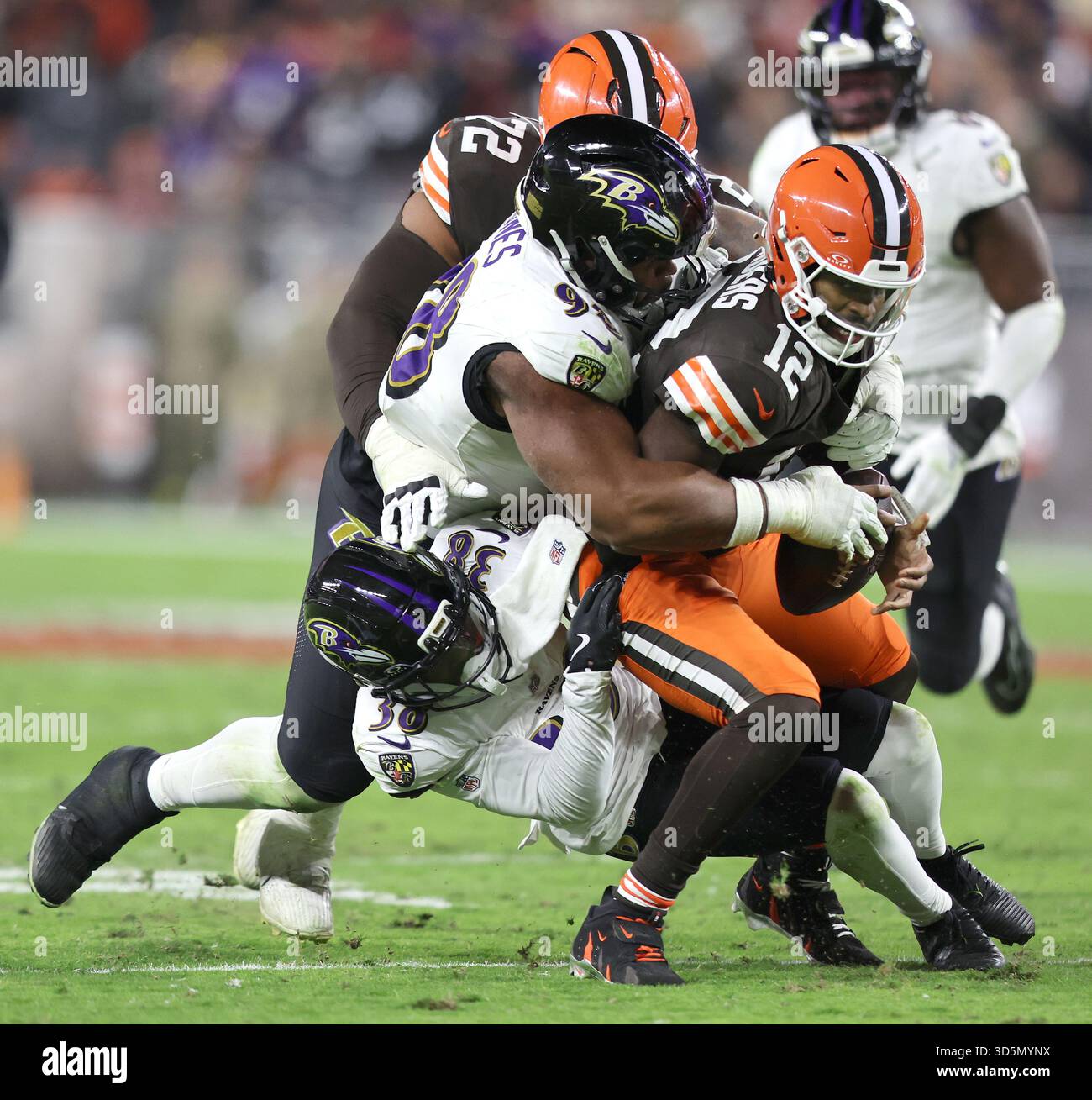 Cleveland Browns Shedeur Sanders (12) is sacked by Baltimore Ravens ...