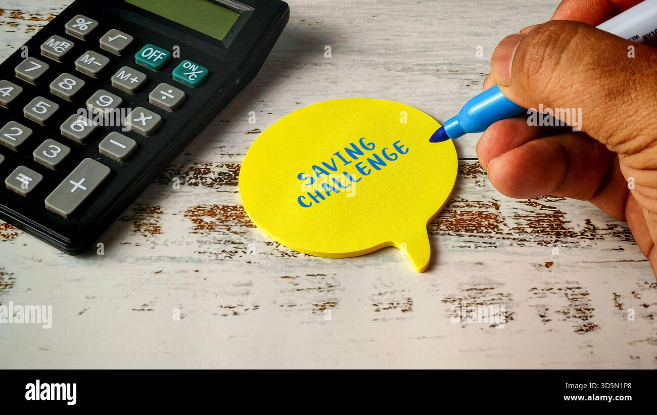 Saving Challenge Financial Plan Concept with Calculator and Hand ...
