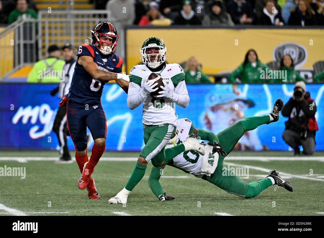 Montreal Alouettes' Tyson Philpot (6) gets intercepted by Saskatchewan ...