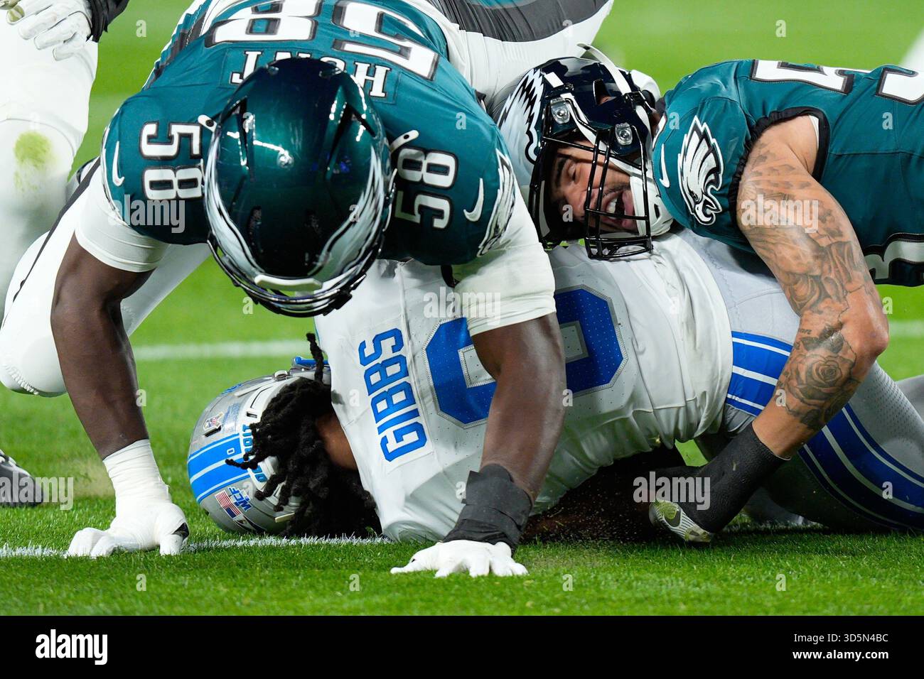 Philadelphia Eagles linebacker Jalyx Hunt (58) leaps over Detroit Lions ...