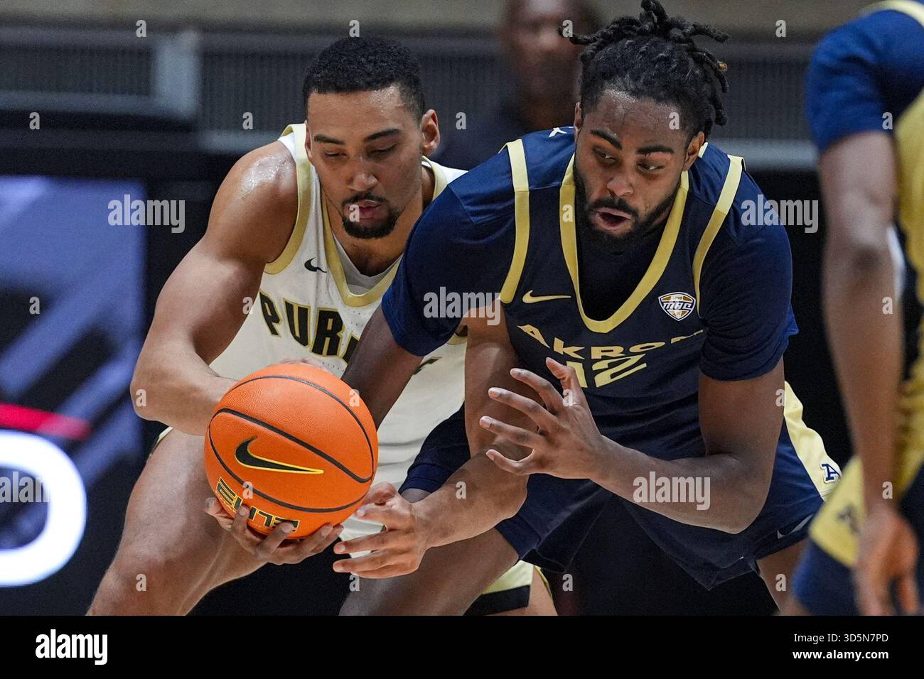 Purdue forward Trey Kaufman-Renn (4) and Akron guard Evan Mahaffey (12 ...