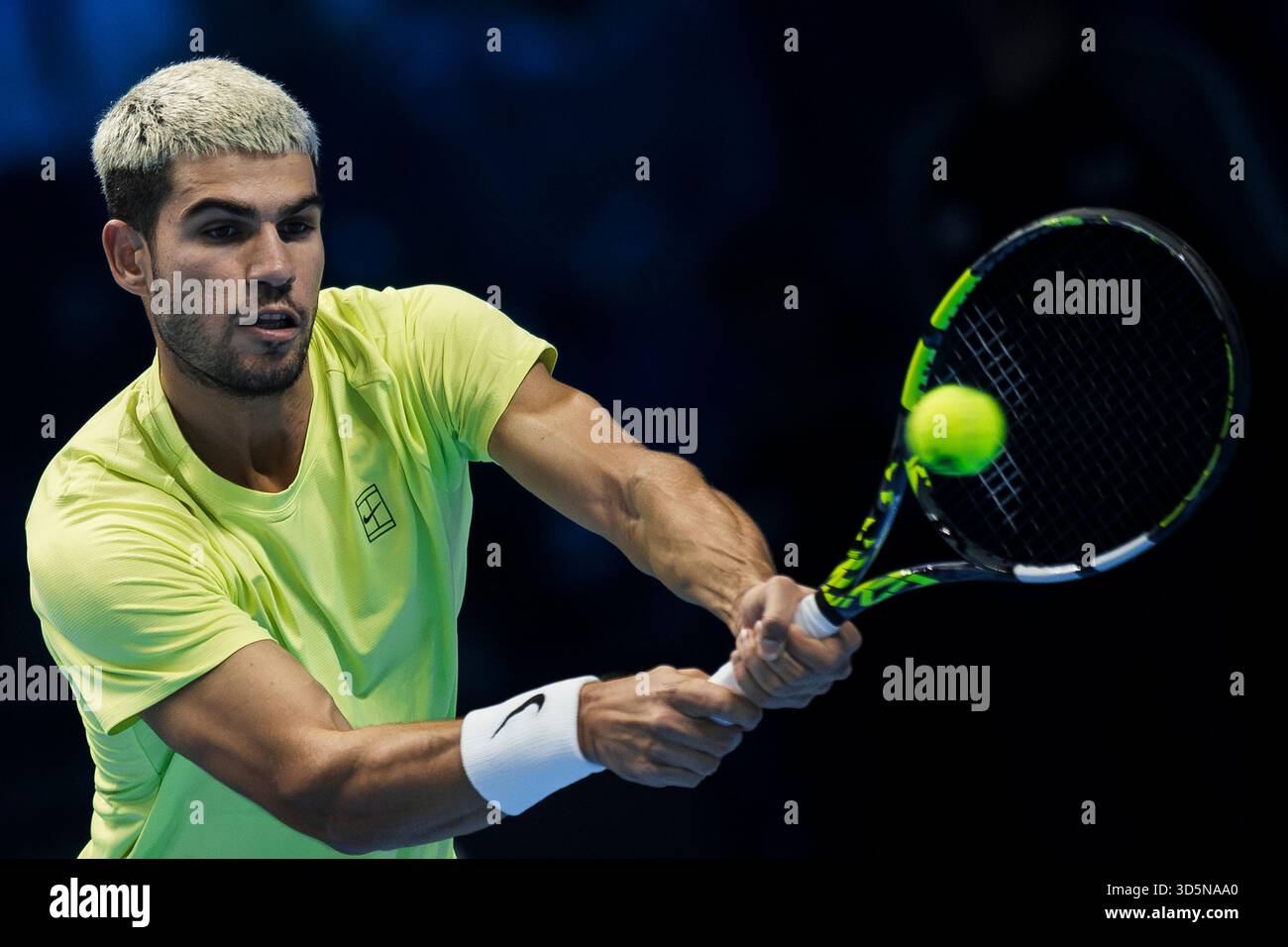 Carlos Alcaraz of Spain plays a backhand during his final singles match ...
