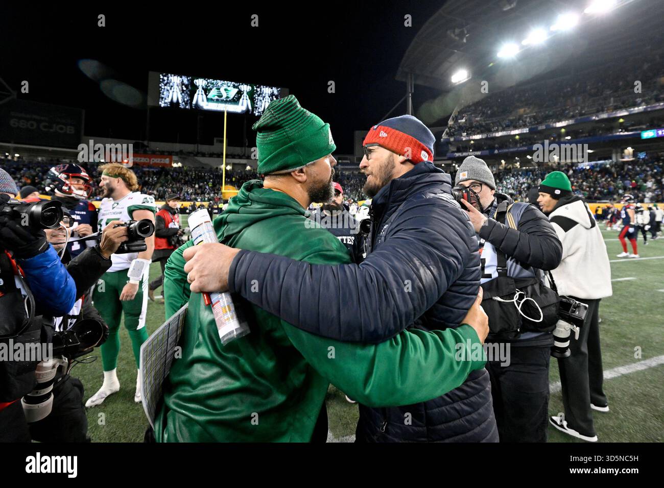 Saskatchewan Roughriders head coach Corey Mace, left, and Montreal ...