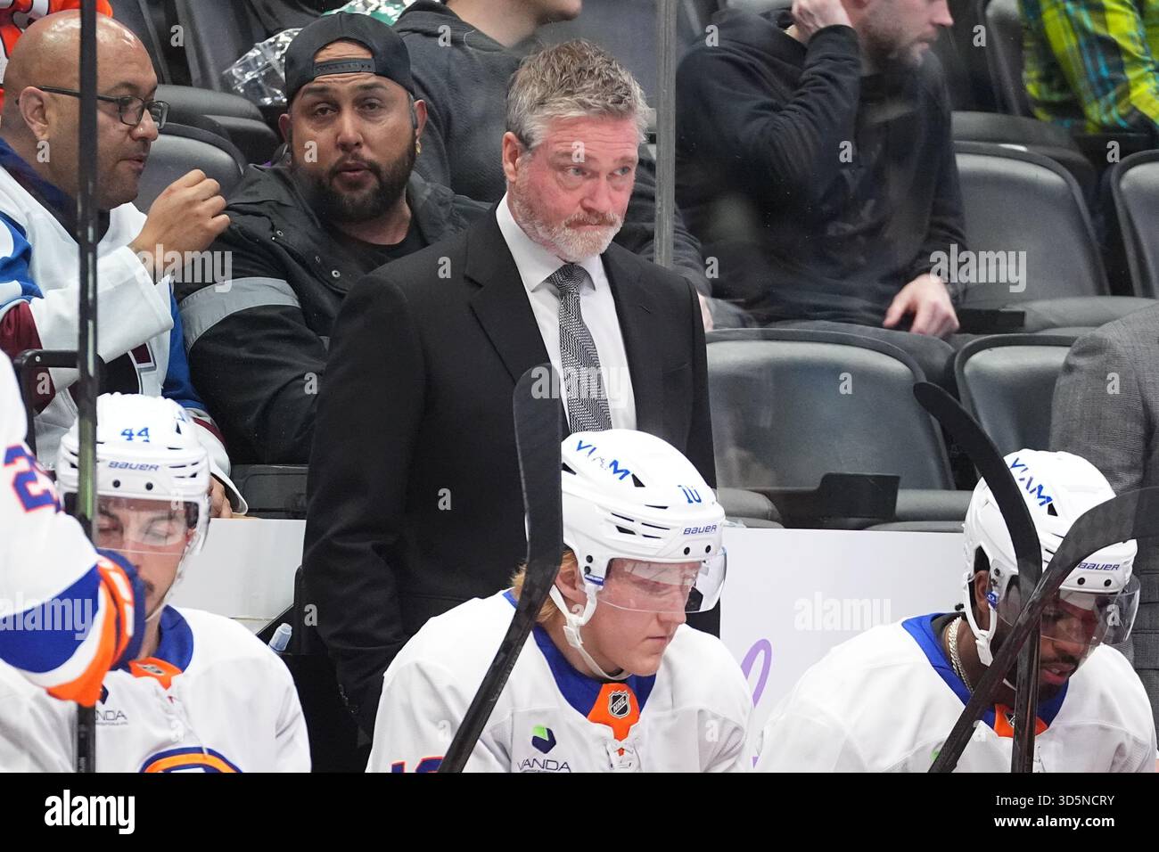 New York Islanders head coach Patrick Roy looks on from the team box in ...