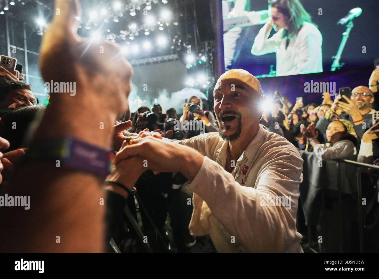Tim Booth, of the English rock band James, approaches fans during his ...