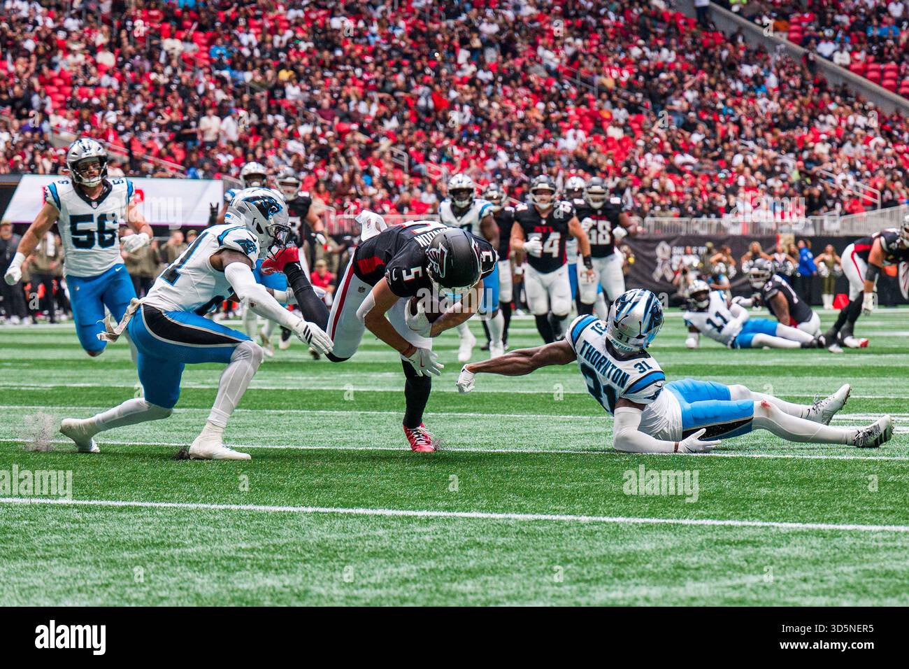 Atlanta Falcons wide receiver Drake London (5) runs the ball as ...