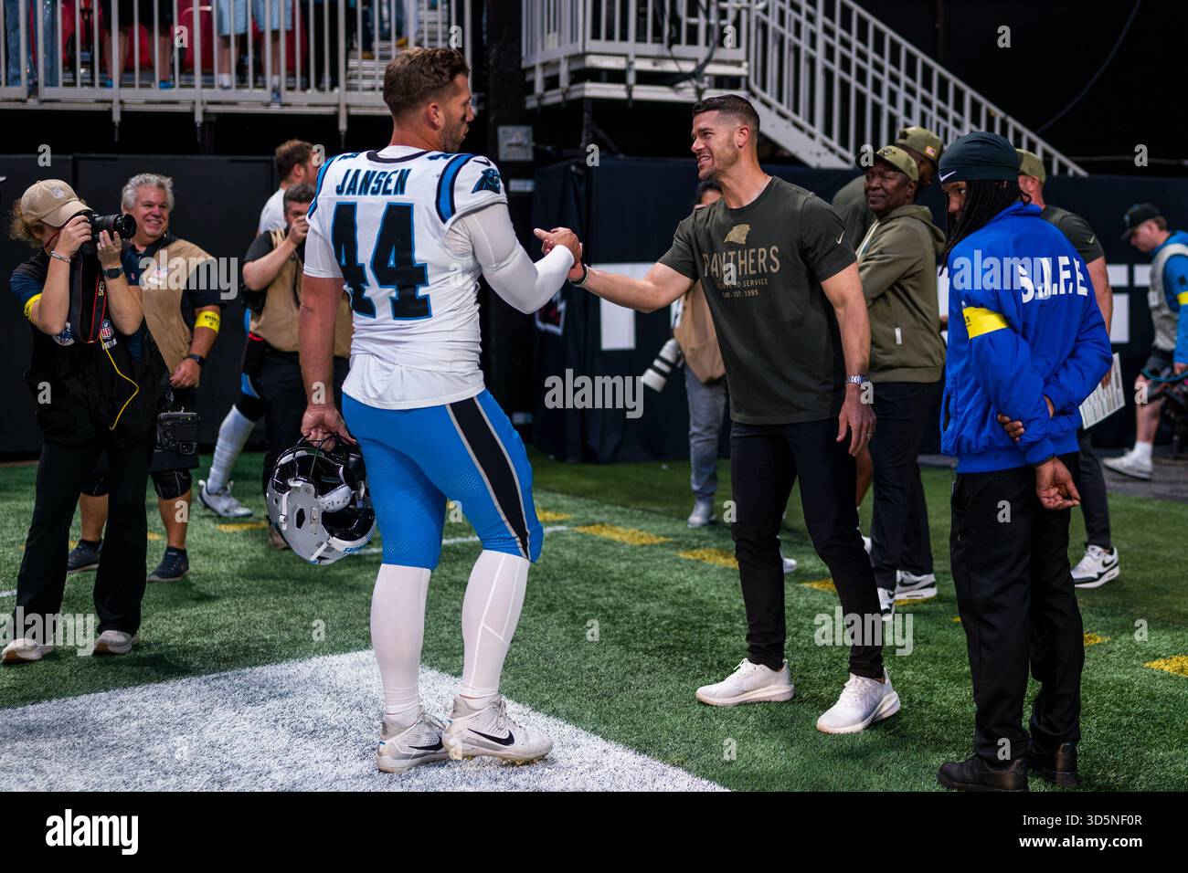 Carolina Panthers long snapper JJ Jansen (44) shakes hands with head ...