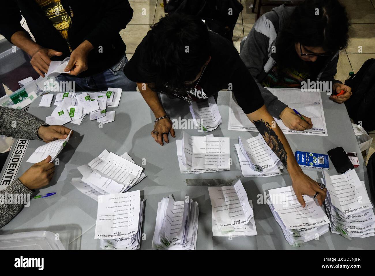 Election officials begin counting votes after the 2025 presidential ...