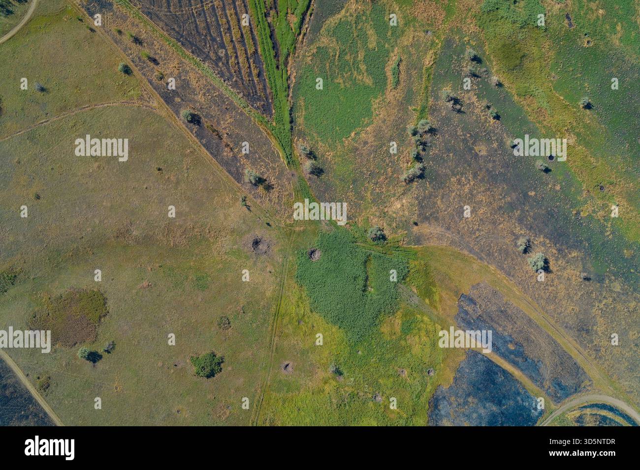Vertical aerial photograph of a complex battlefield landscape featuring ...